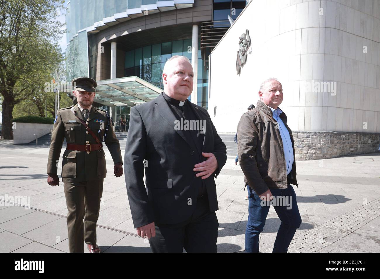 Father Paul Murphy (centre) leaving the Central Criminal Court in ...