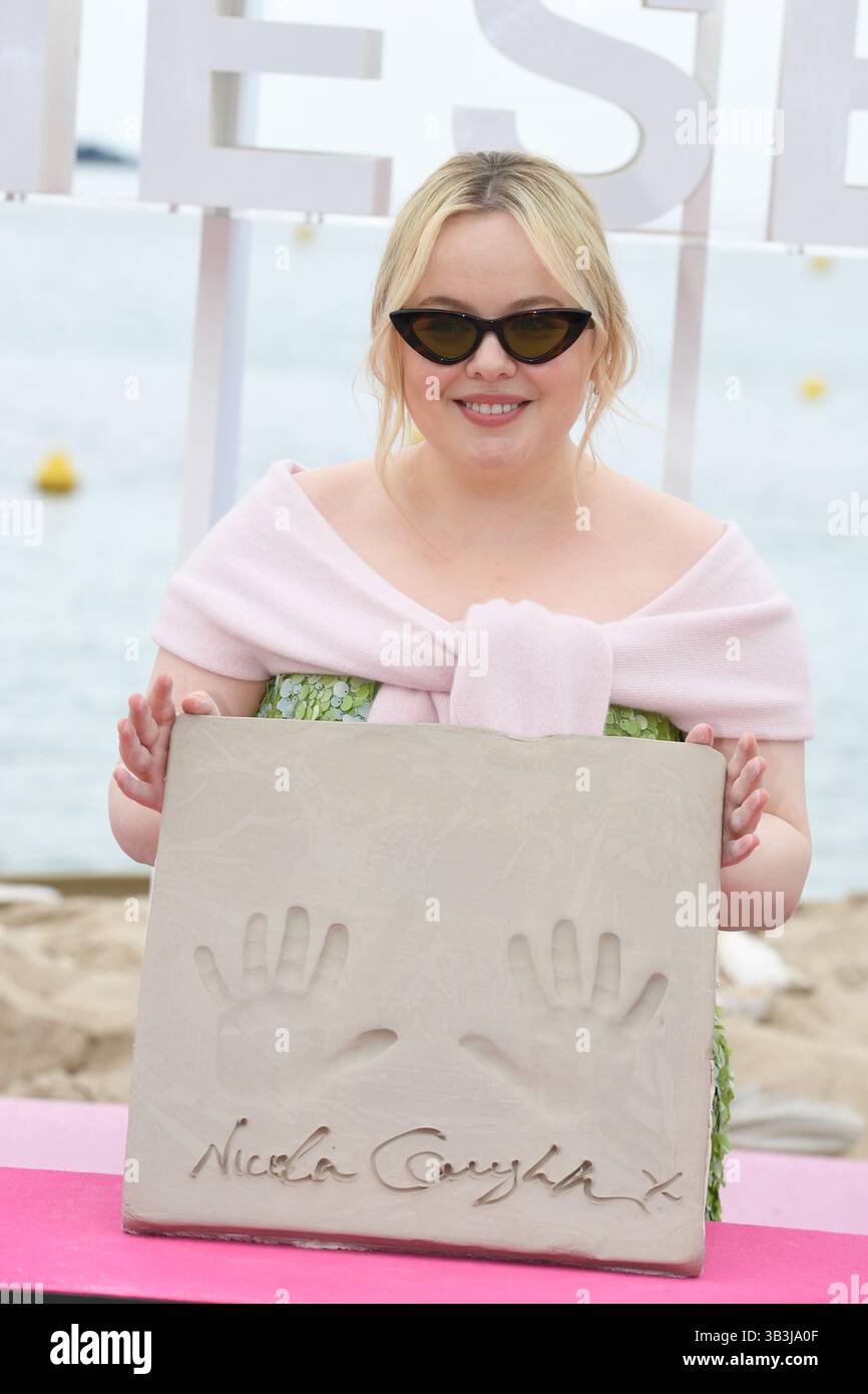 Nicola Coughlan shows off her handprints in cement during the "Prix ...