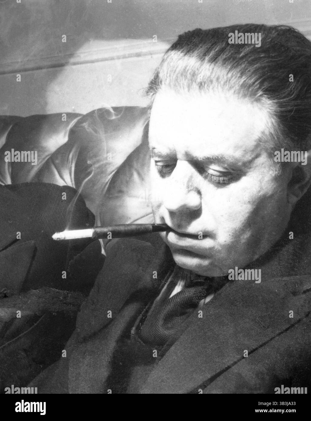 Man smoking a cigar, Italy 1950s Stock Photo - Alamy