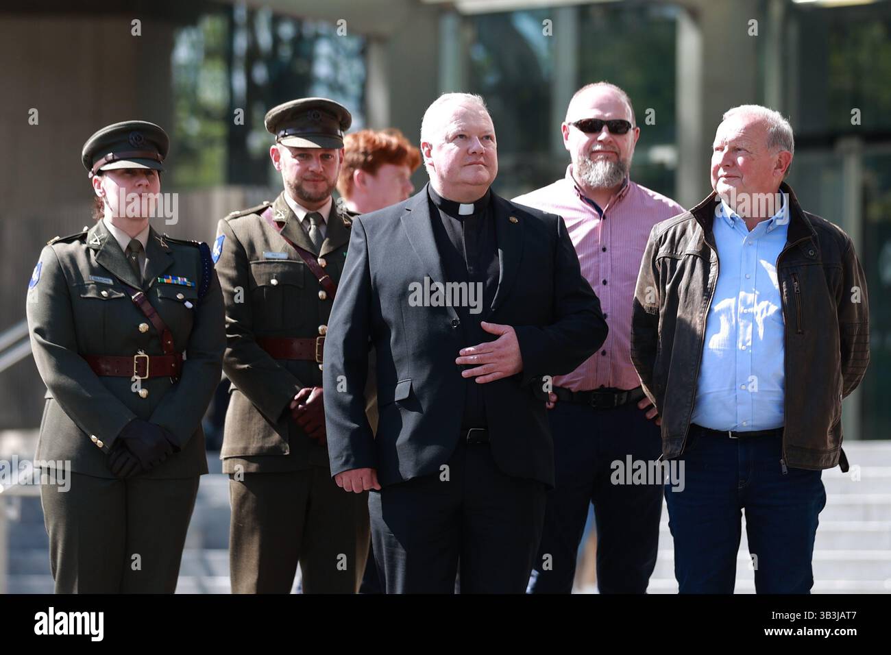 Father Paul Murphy (centre) is accompanied by members of the Irish ...
