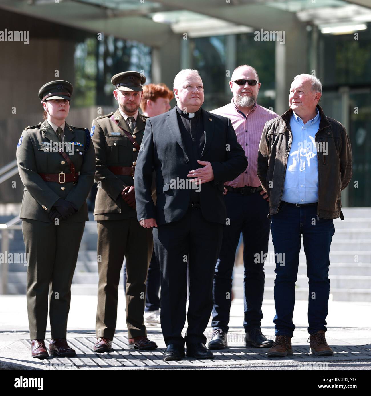 Father Paul Murphy (centre) is accompanied by members of the Irish ...