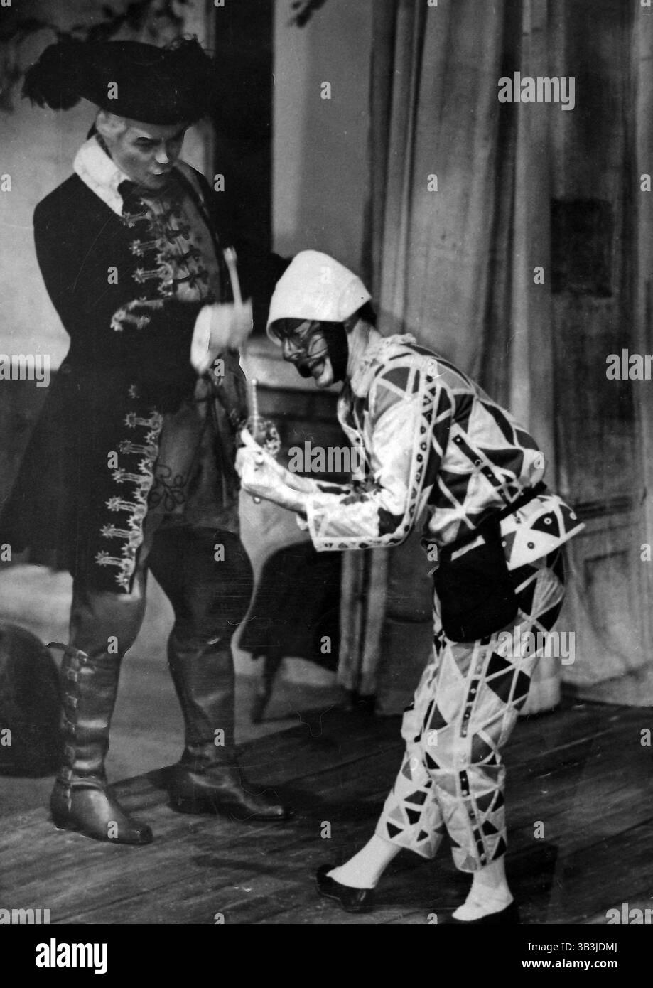 Harlequin, character of the Italian commedia dell'arte, performing at ...