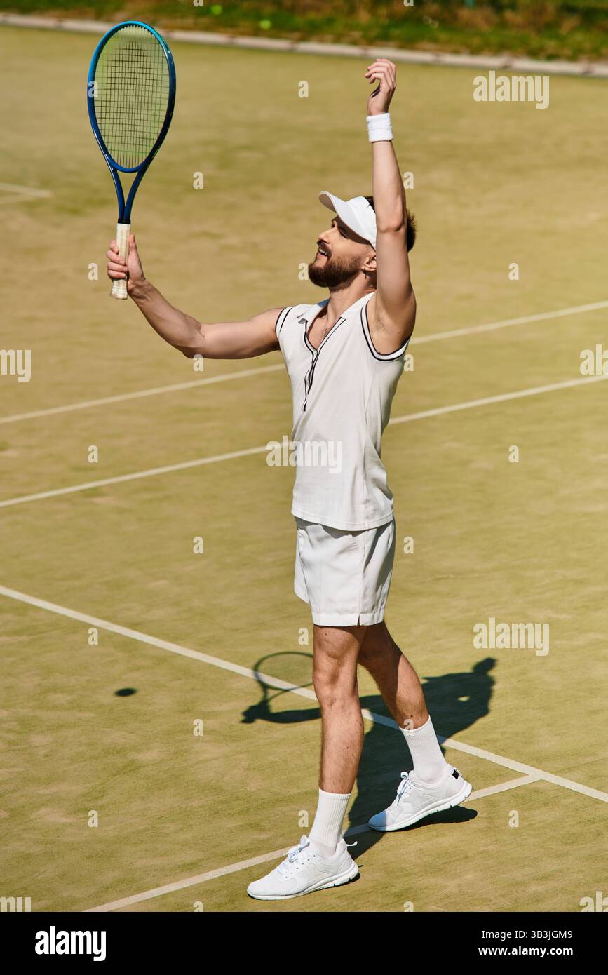 A young man in white sportswear celebrates a successful shot while ...