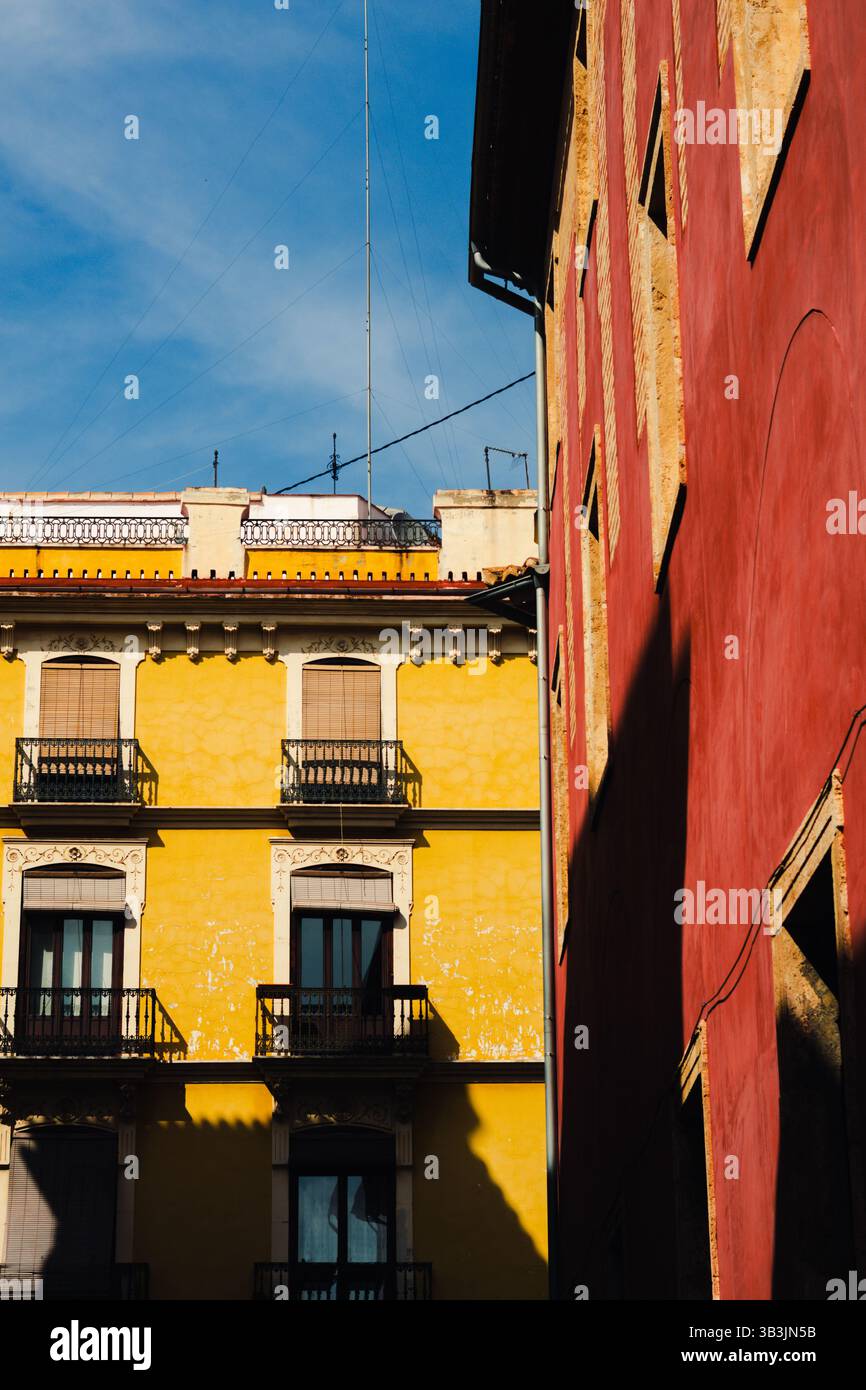 Colorful building façades under a blue sky in Valencia Stock Photo - Alamy