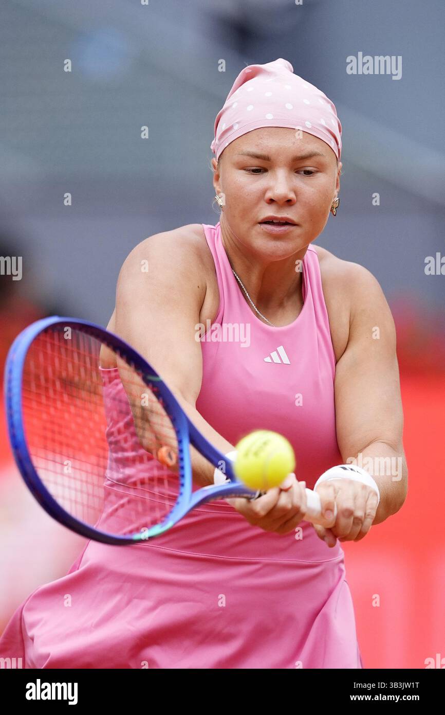 Diana Shnaider of Russia in action against Iga Swiatek of Poland during ...
