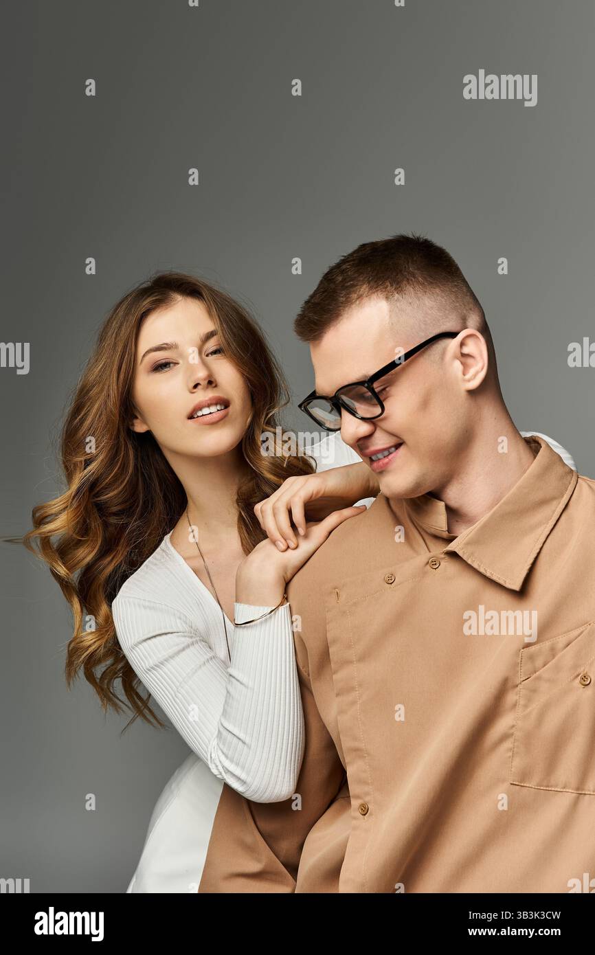 Romantic couple poses together, showcasing their love and elegance ...