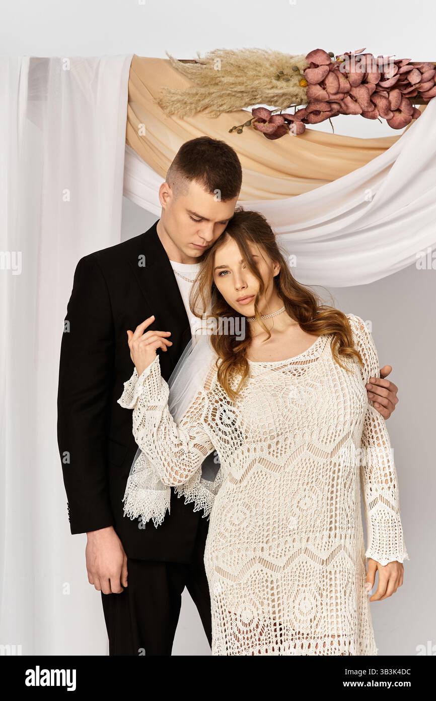 A beautiful bride and groom showcase their love in an elegant, stunning ...