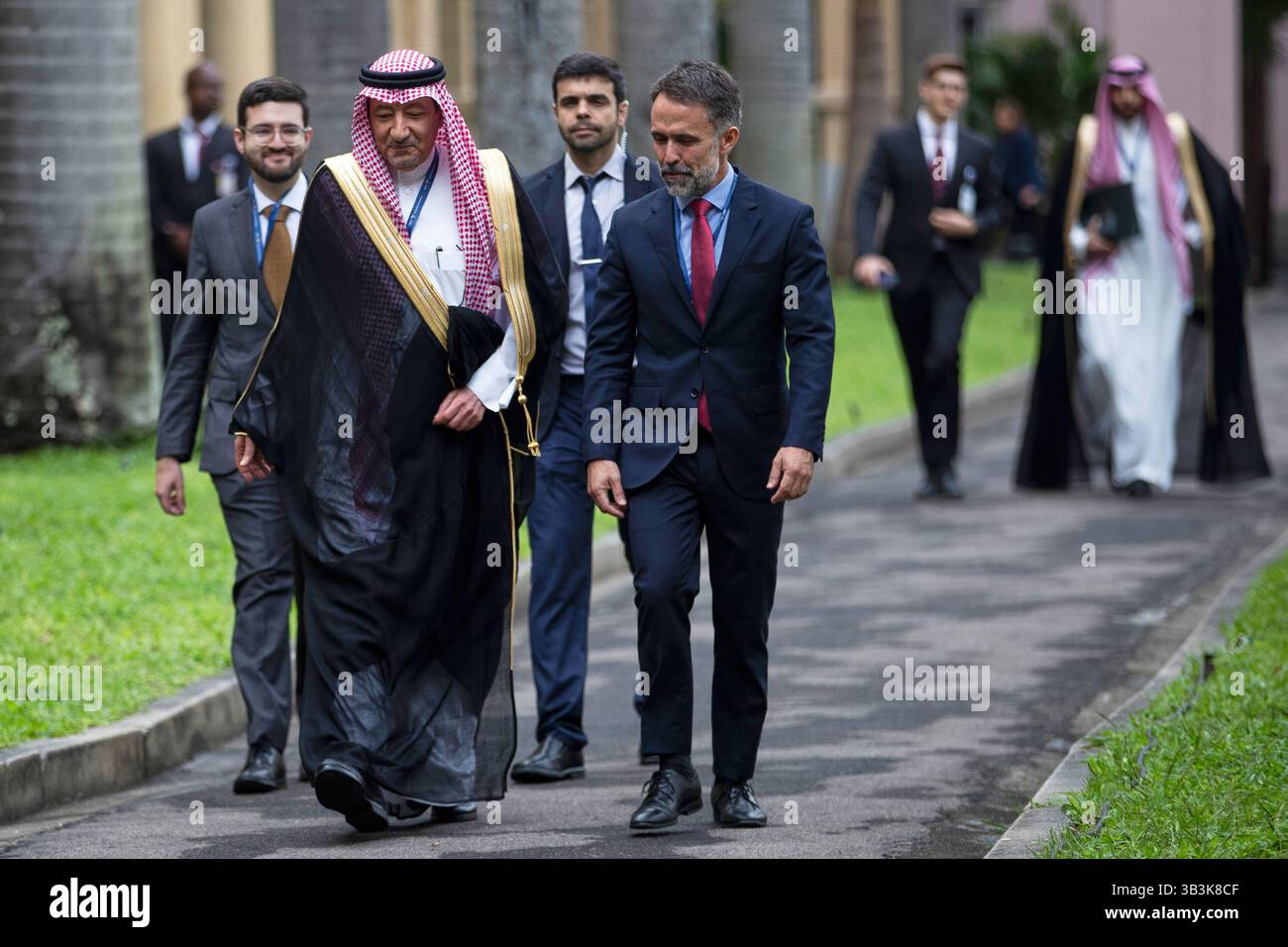 Saudi Arabia's Deputy Foreign Minister Waleed al-Khuraiji, front left ...