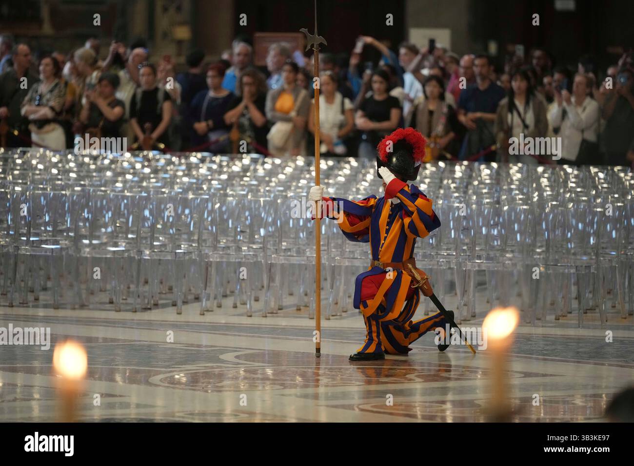 A Swiss Guard salutes during a mass on the fourth of nine days of ...