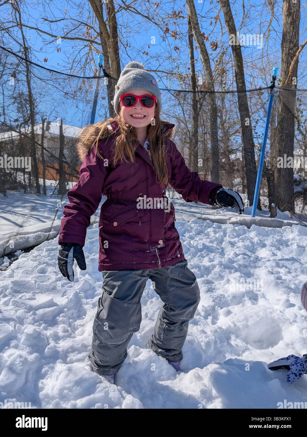 Kids playing in the snow Stock Photo - Alamy