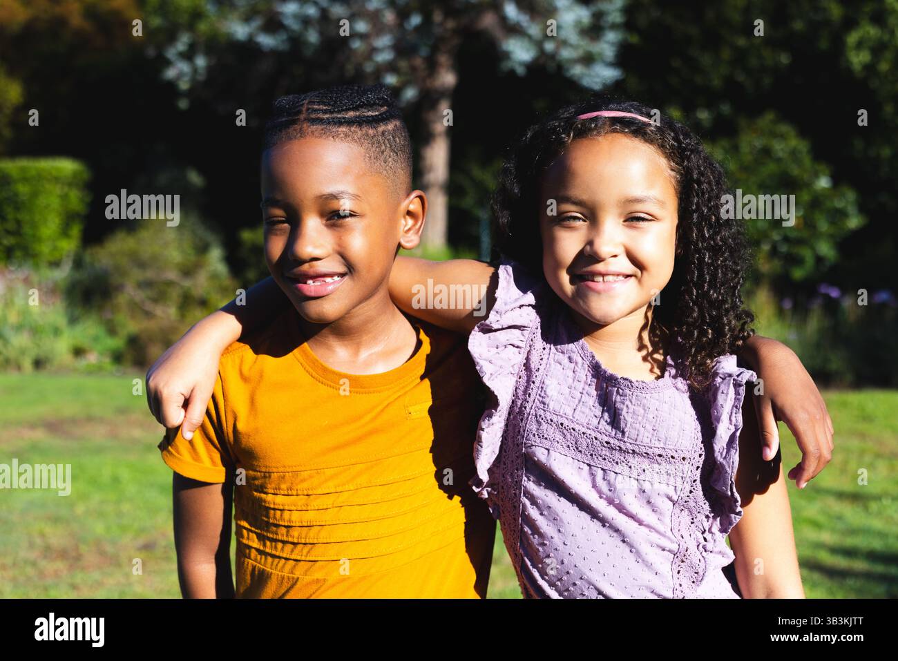 Smiling diverse child siblings hi-res stock photography and images - Alamy