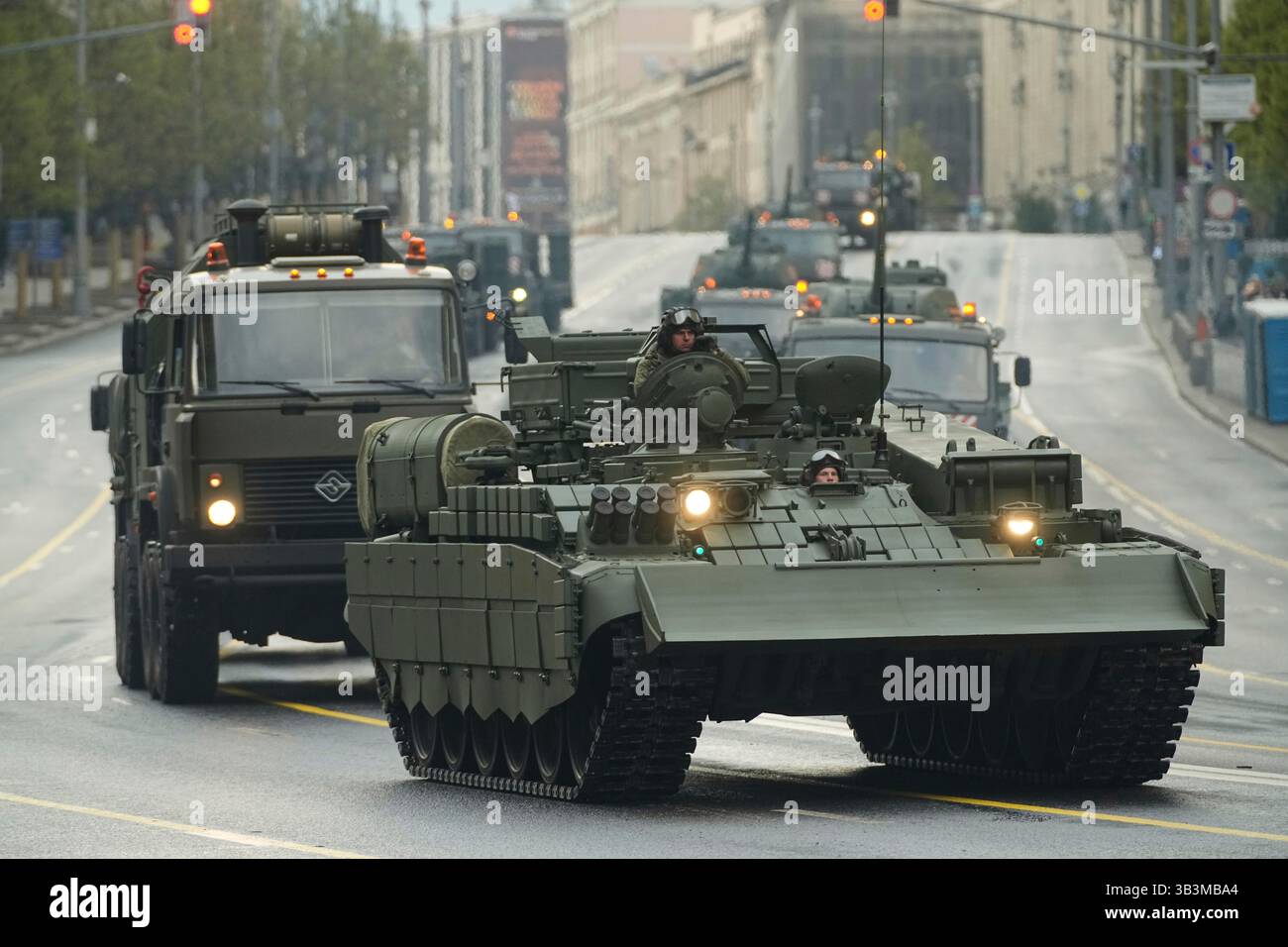 Russian armoured vehicles roll along a street toward Red Square to ...