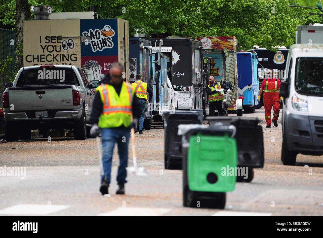 City workers begin to clear the scene where a driver killed multiple people last week during a ...