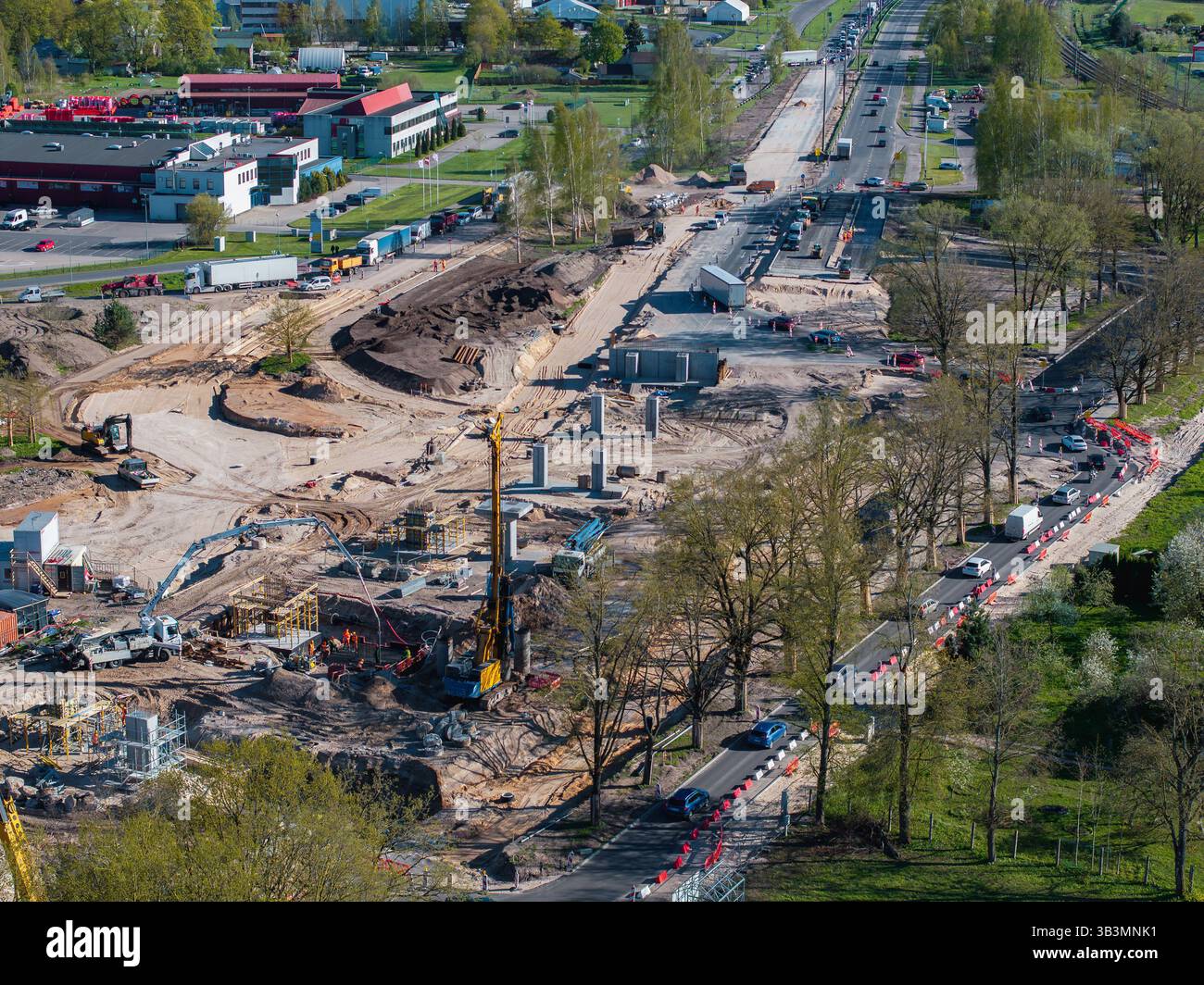 Active construction site in Riga, Latvia, showing cranes, excavators ...