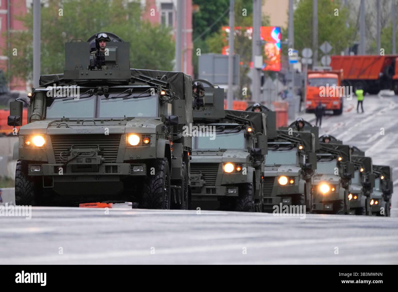 Russian armoured vehicles roll along the street toward Red Square to ...
