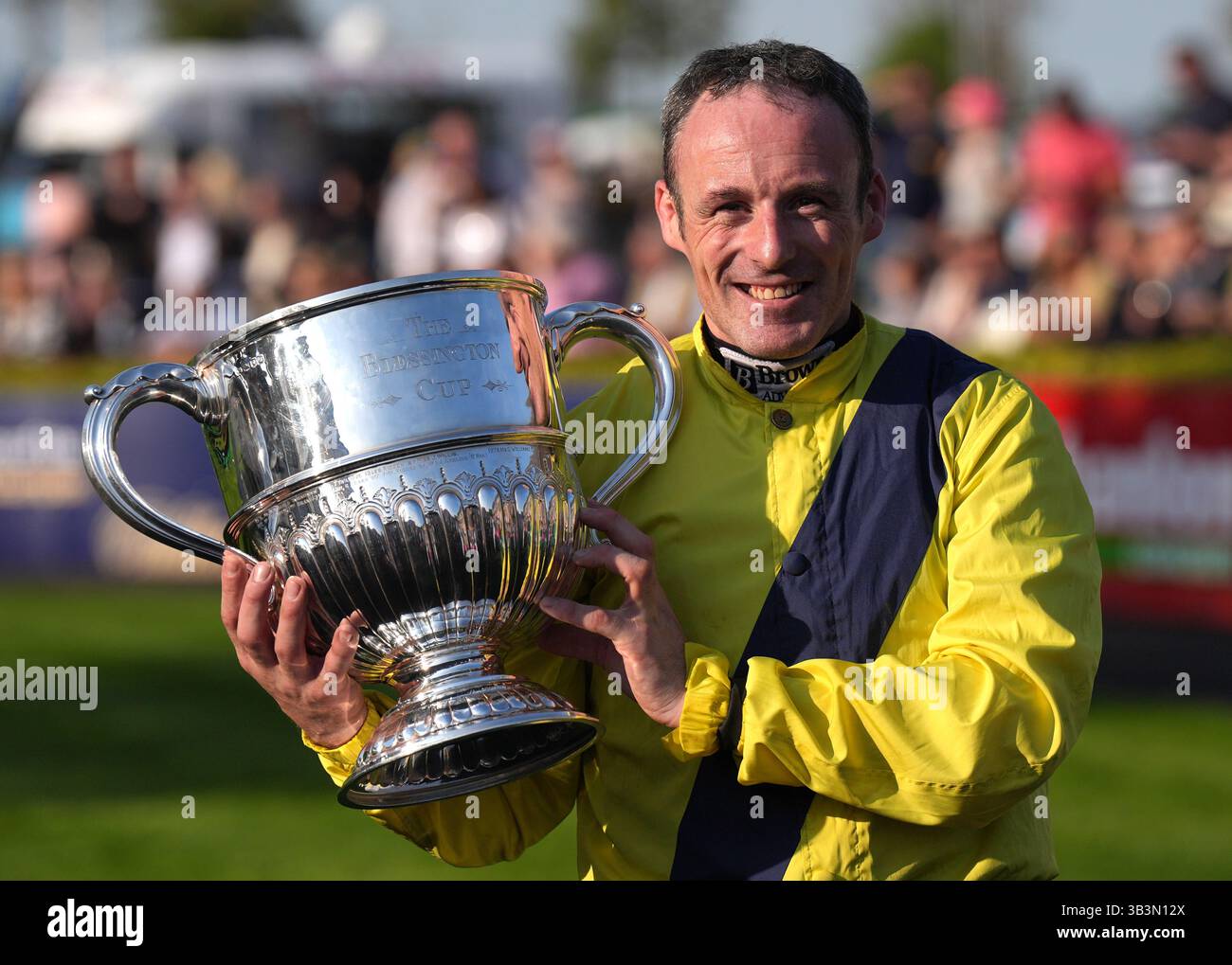 Sean Flanagan lifts the trophy after winning the William Hill Champion ...