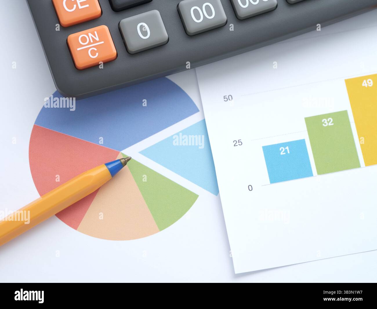 Financial statements. Business Graph. A ballpoint pen and a calculator ...