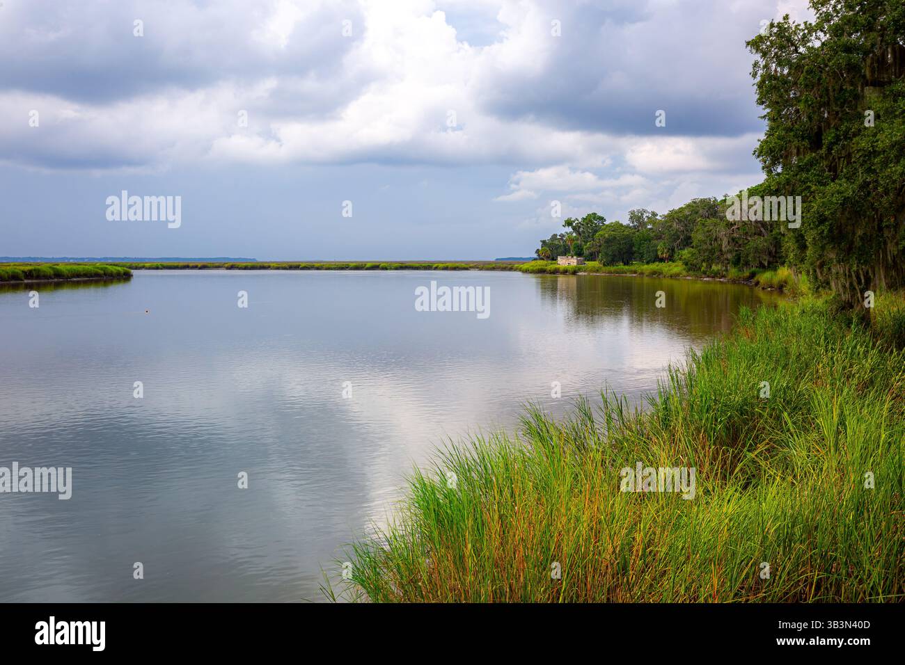 Still water in coastal inlet on a quiet summer day Stock Photo - Alamy