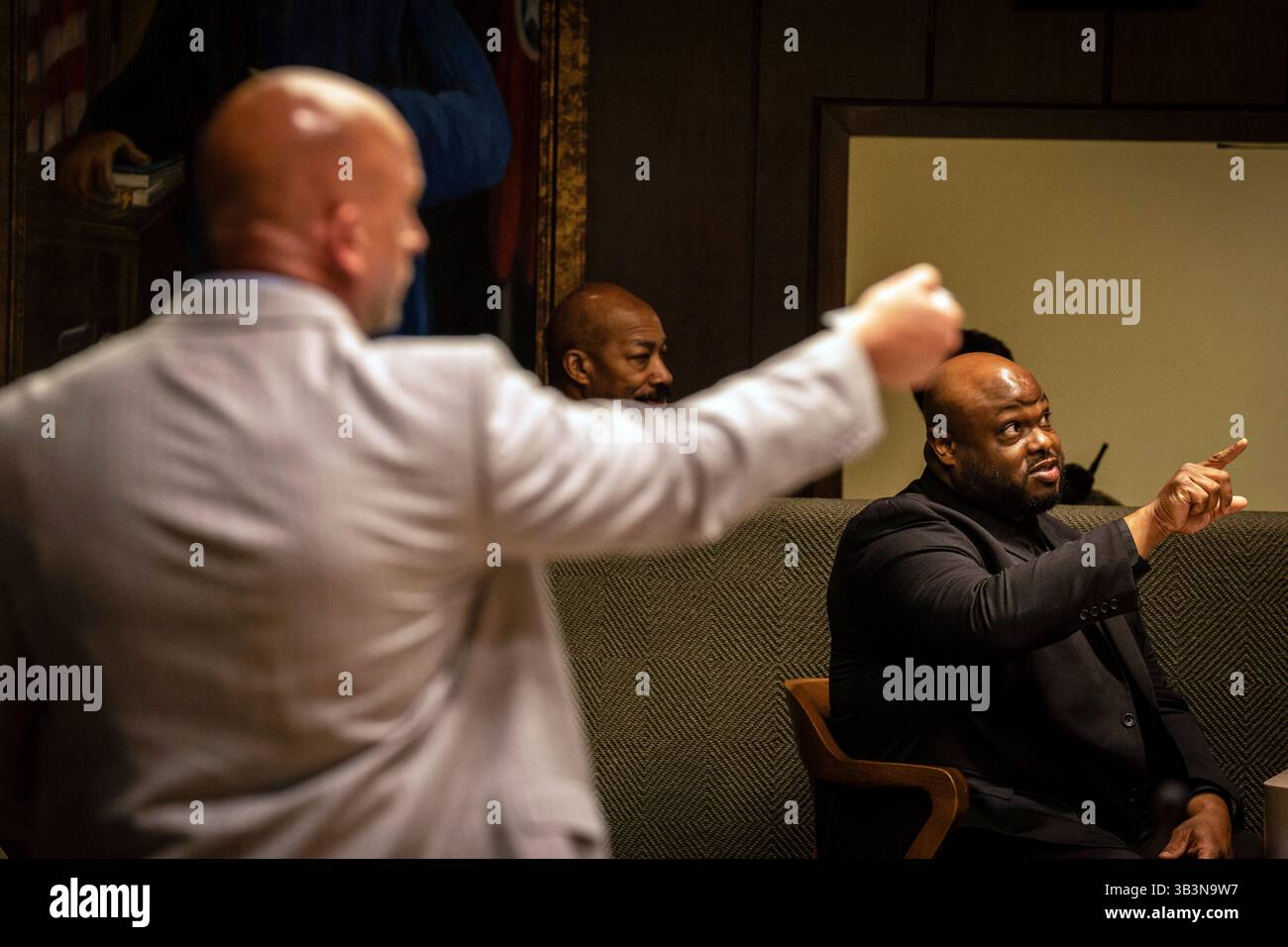 Former Memphis police officer Desmond Mills, right, responds to ...