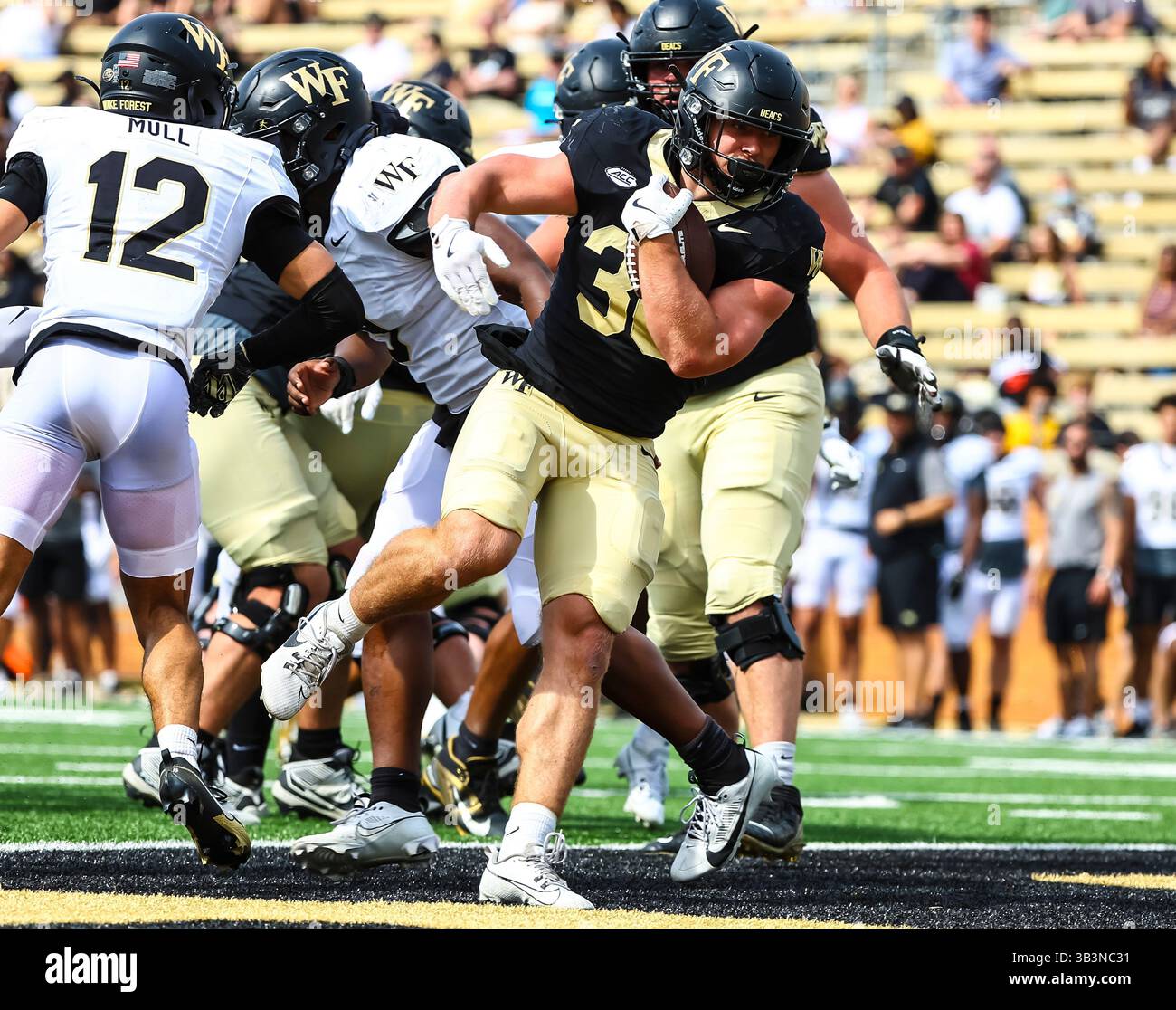 April 19, 2025: Wake Forest junior Tate Carney (30) scores touch down ...