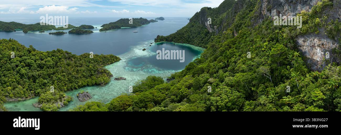 Rugged limestone islands rise from the warm seas of Misool, Raja Ampat ...