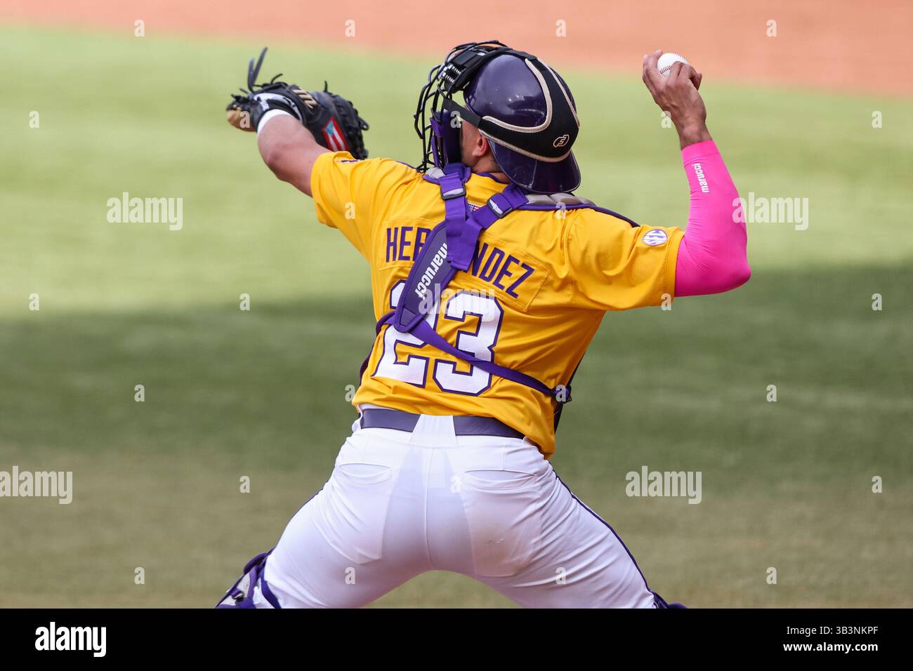 April 19, 2025: LSU catcher Luis Hernandez (23) throws the ball to ...