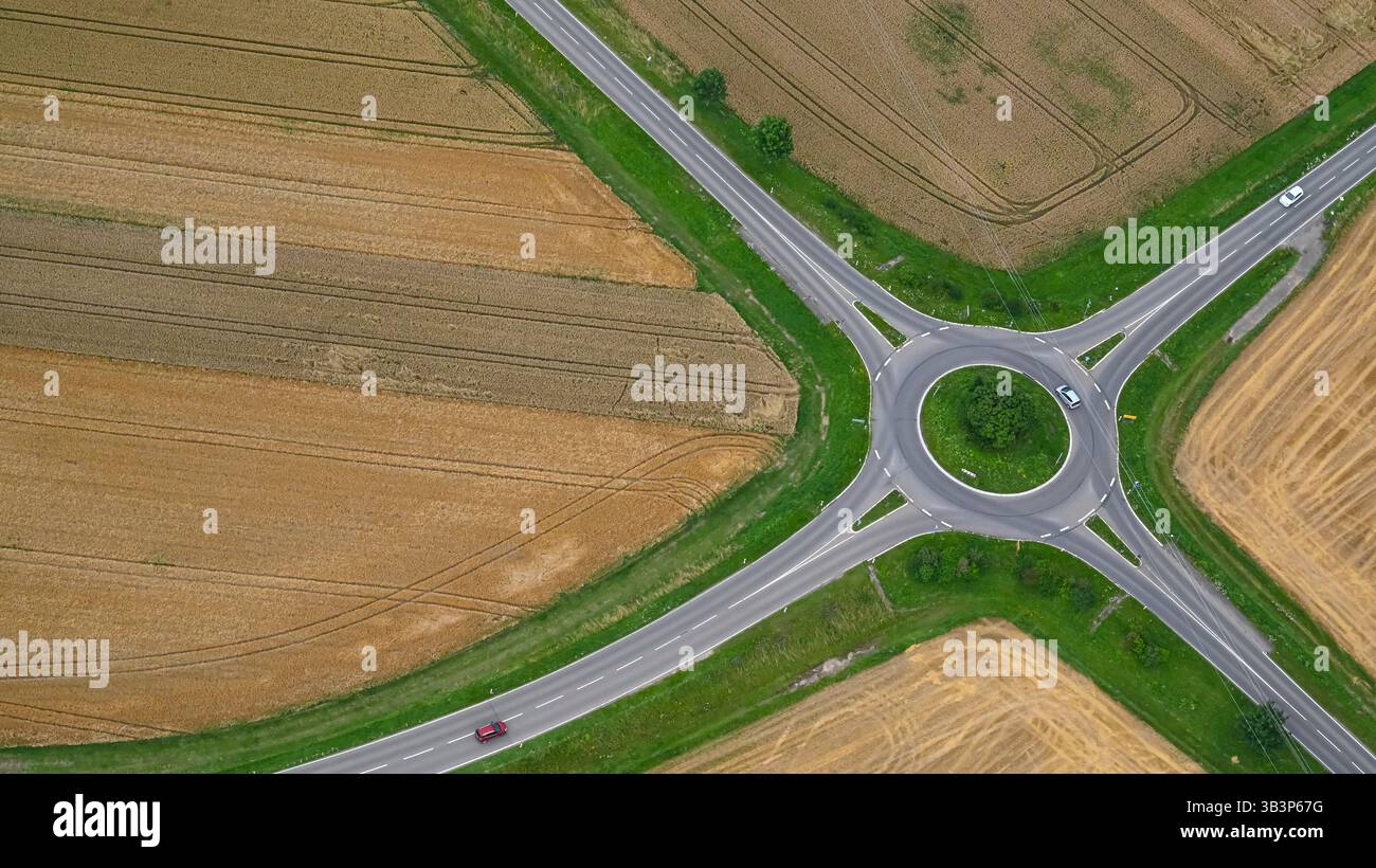 Country road, highway and traffic circle from above with drone view or ...