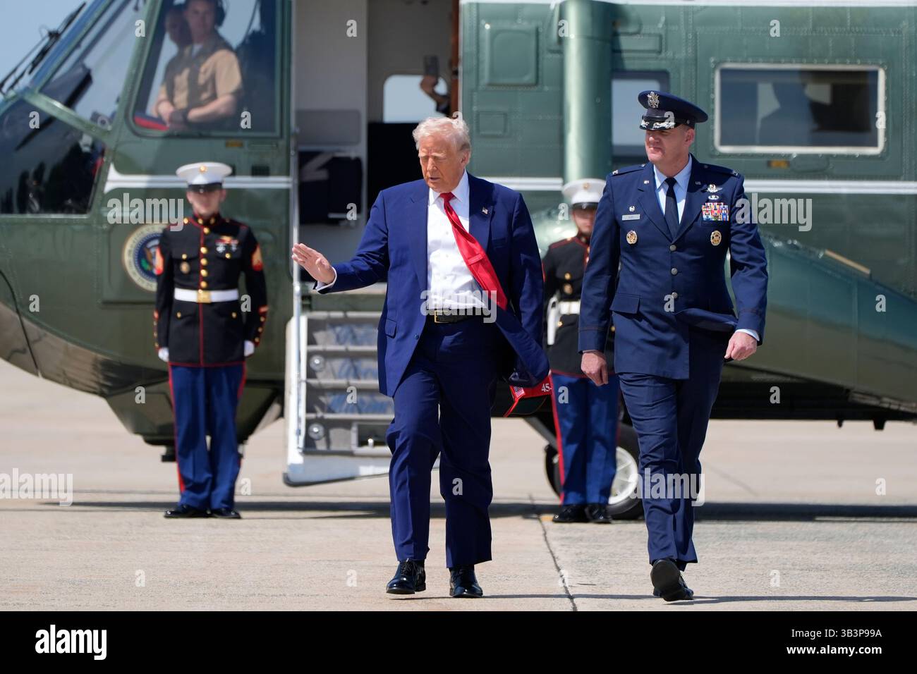 President Donald Trump walking across the tarmac before boarding Air ...