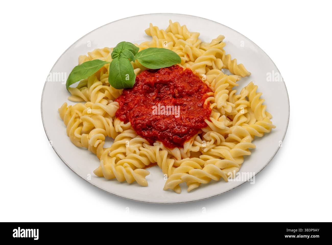 Fusilli macaroni pasta with tomato sauce and basil leaf in plate ...