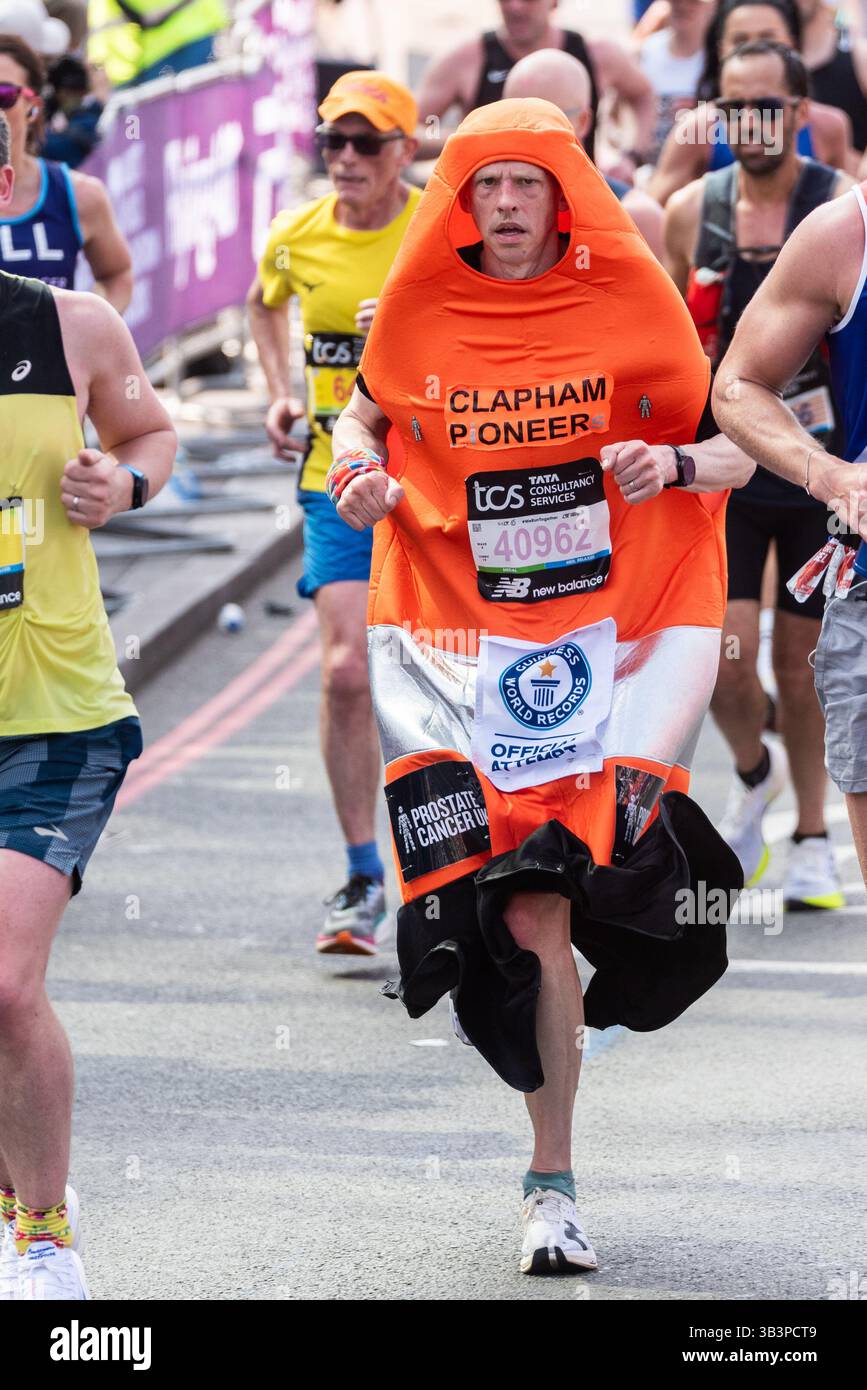 Michael Wiggins competing in the 2025 TCS London Marathon, passing ...