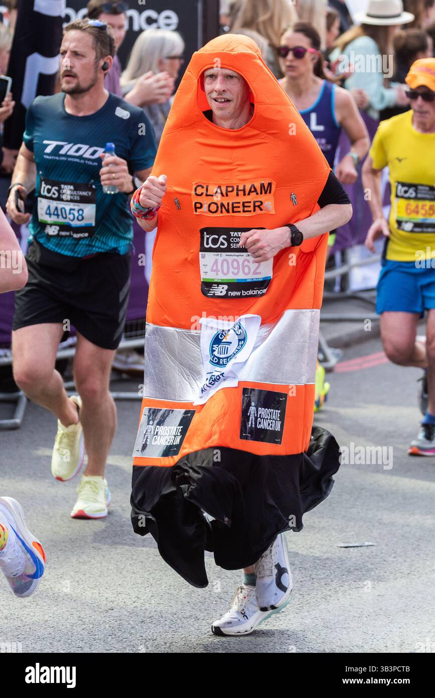 Michael Wiggins competing in the 2025 TCS London Marathon, passing ...