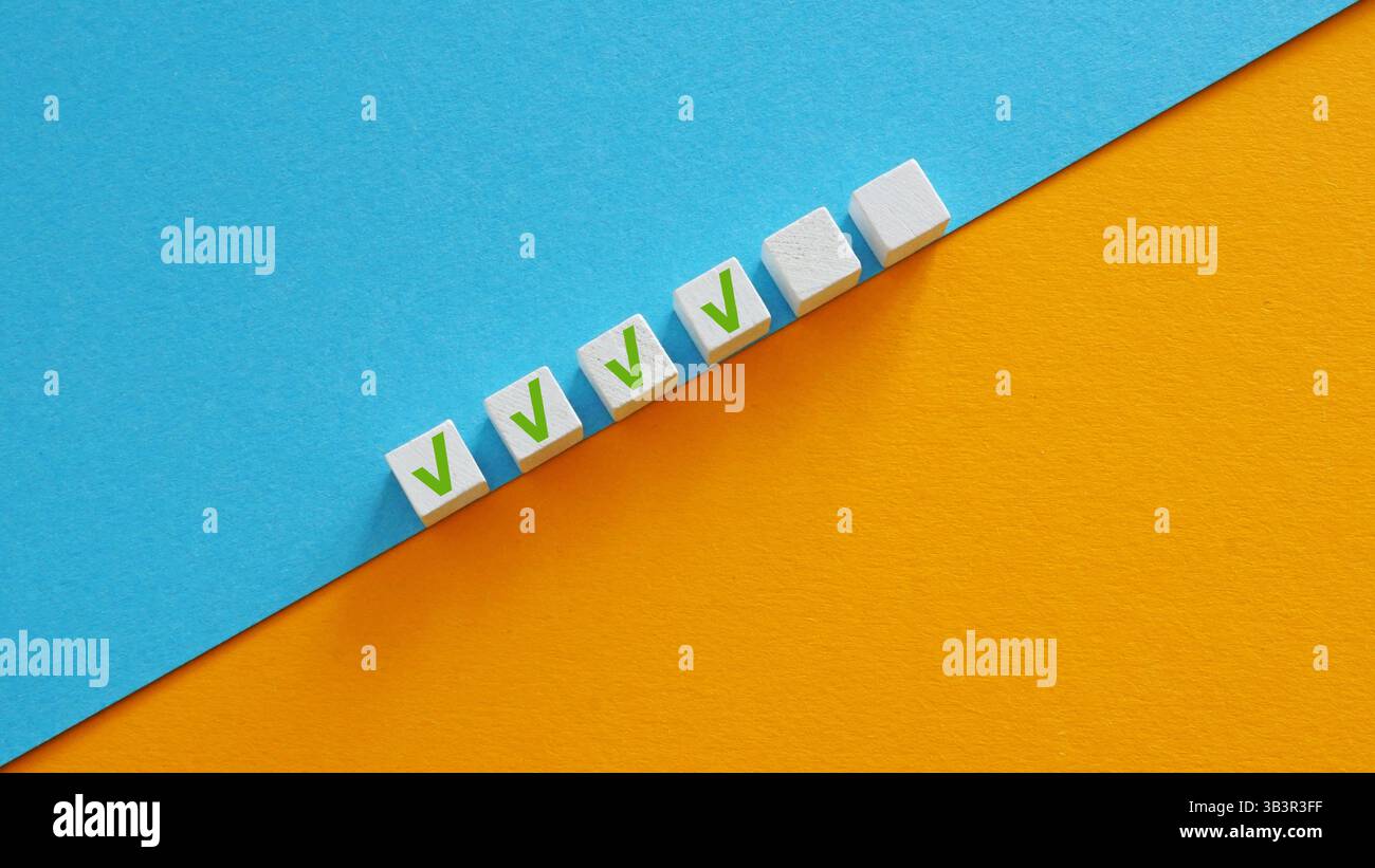 Cubes symbolizing completed parts of a plan or checklist. Task ...