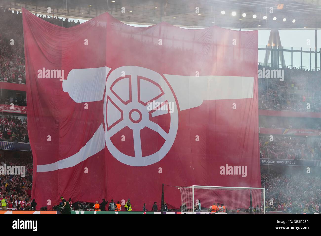A large Arsenal flag is unfurled by supporters ahead of the Champions ...