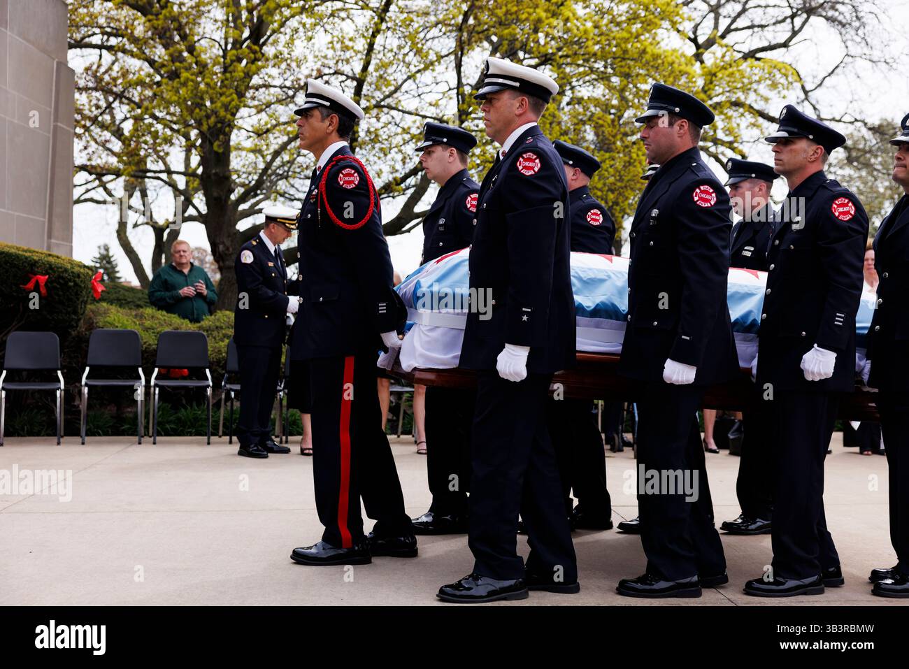 Pallbearers carry the casket into the funeral for Chicago Fire ...