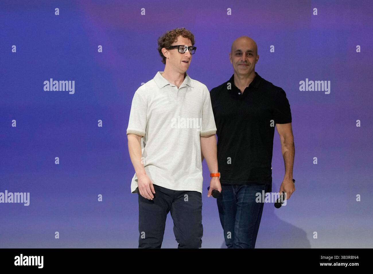 Meta Founder and CEO Mark Zuckerberg, left, walks on stage with ...