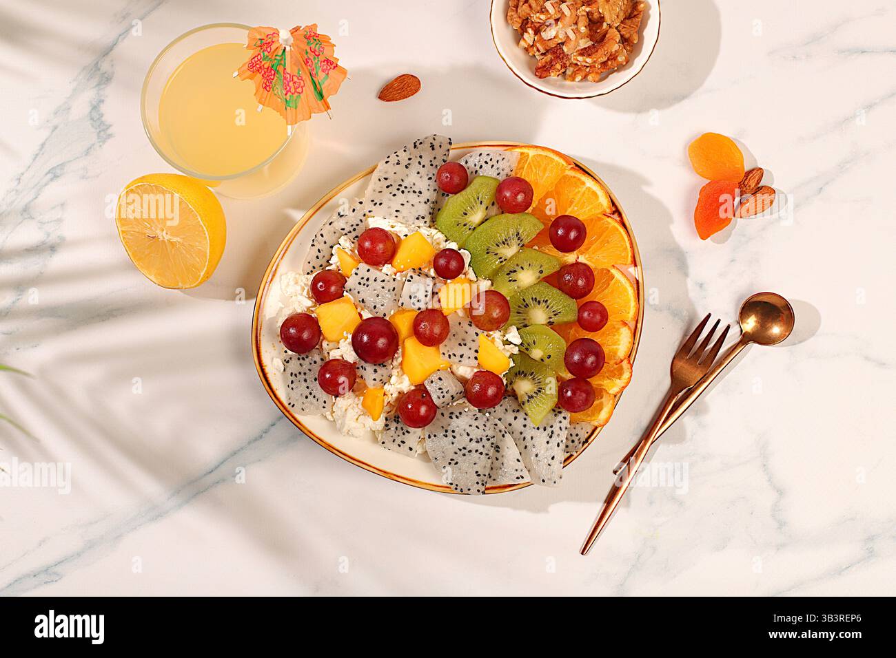 Kitchen background with fruit salads with soft grain cottage cheese, yogurt, dragon fruit, kiwi ...