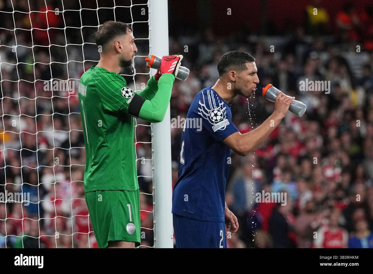 PSG's goalkeeper Gianluigi Donnarumma and PSG's Achraf Hakimi have a ...