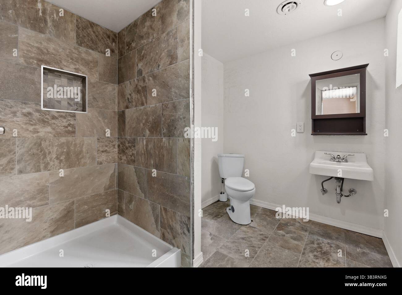 A wellequipped bathroom featuring essential fixtures including a toilet ...