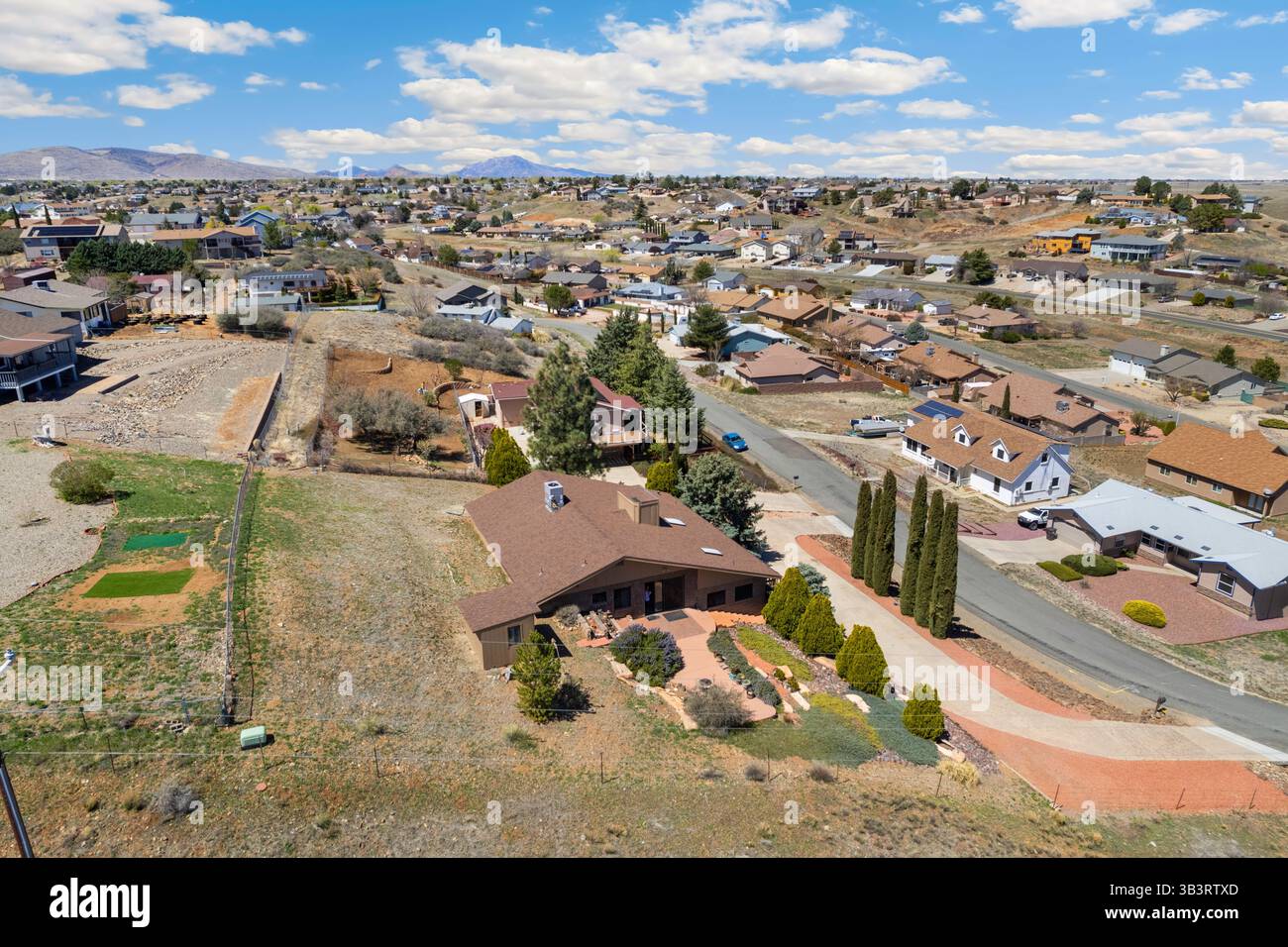 This image depicts an aerial view of a charming house situated in the ...