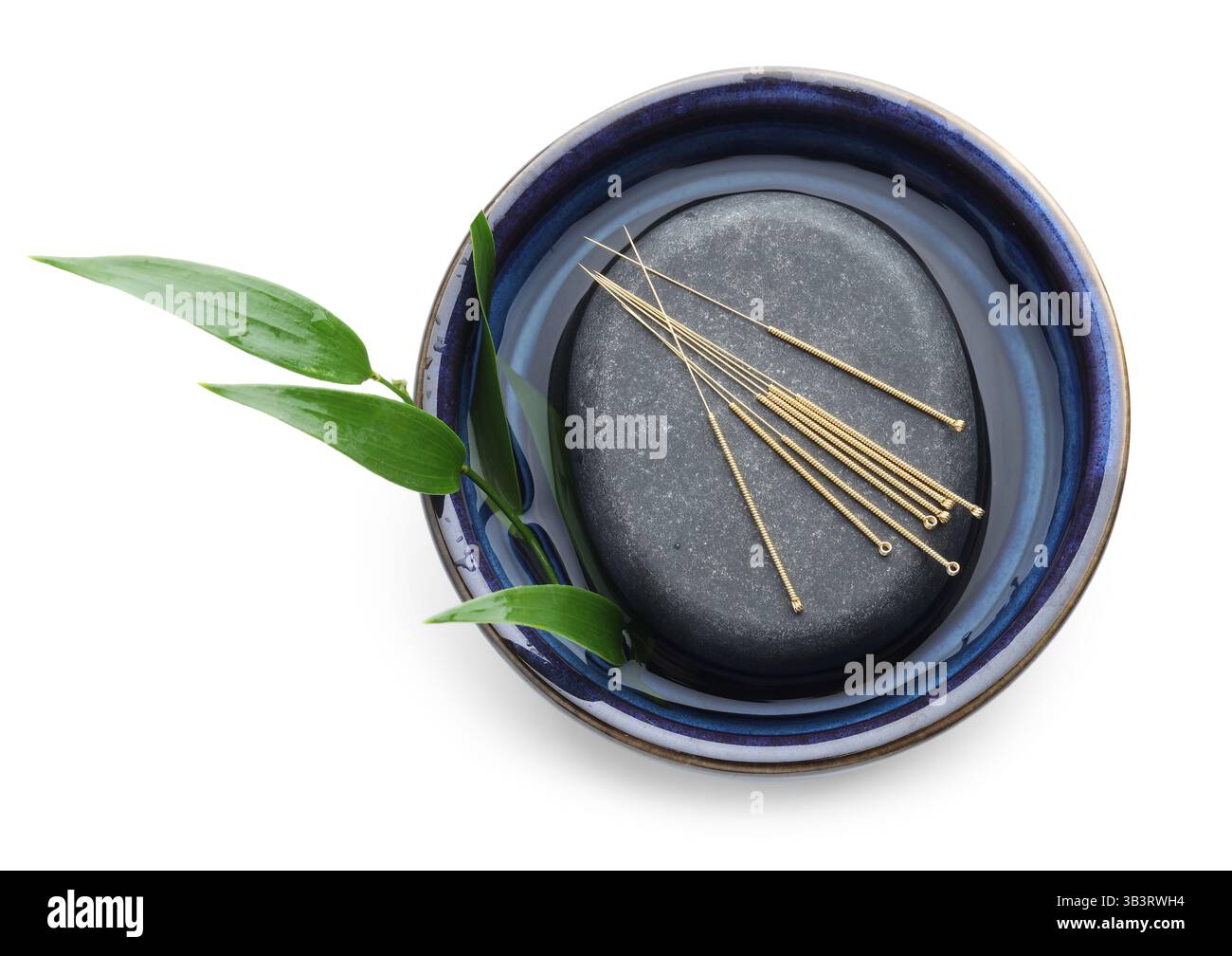 Acupuncture needles, spa stone and leaves isolated on white, top view ...