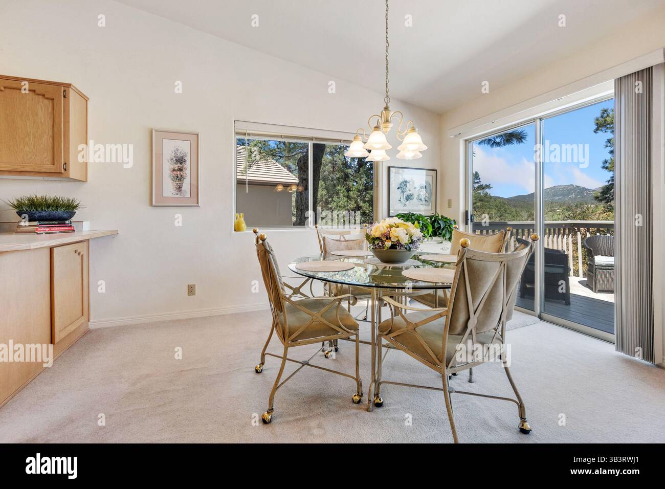 In a cozy dining room, there is a wellset table accompanied by ...