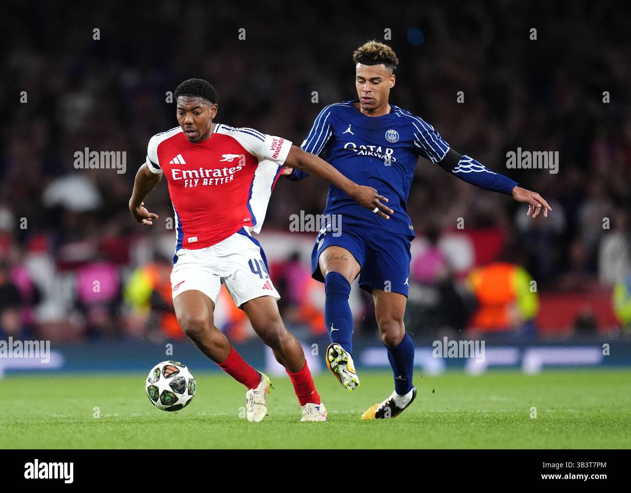 Arsenal's Myles Lewis-Skelly (left) and Paris Saint Germain's Desire ...