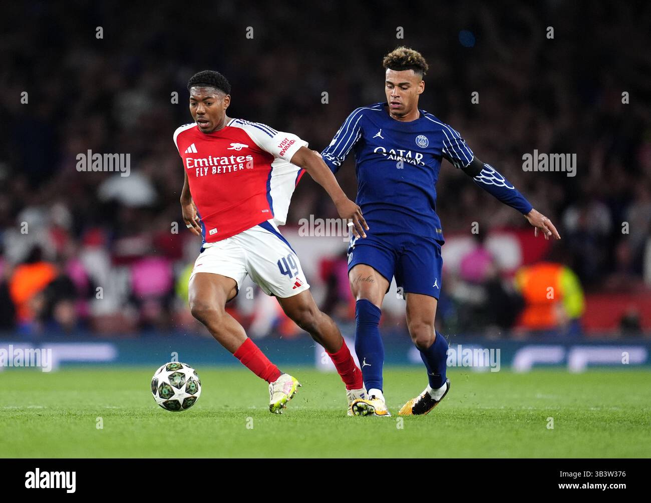 Arsenal's Myles Lewis-Skelly (left) and Paris Saint Germain's Desire ...