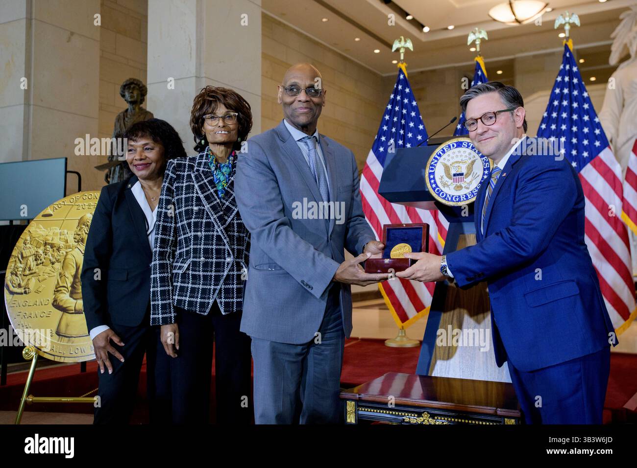 House Speaker Mike Johnson, R-La., right, presents the Congressional ...