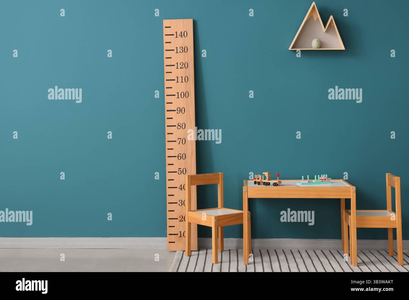 Interior of children's room with table, chairs and stadiometer Stock ...