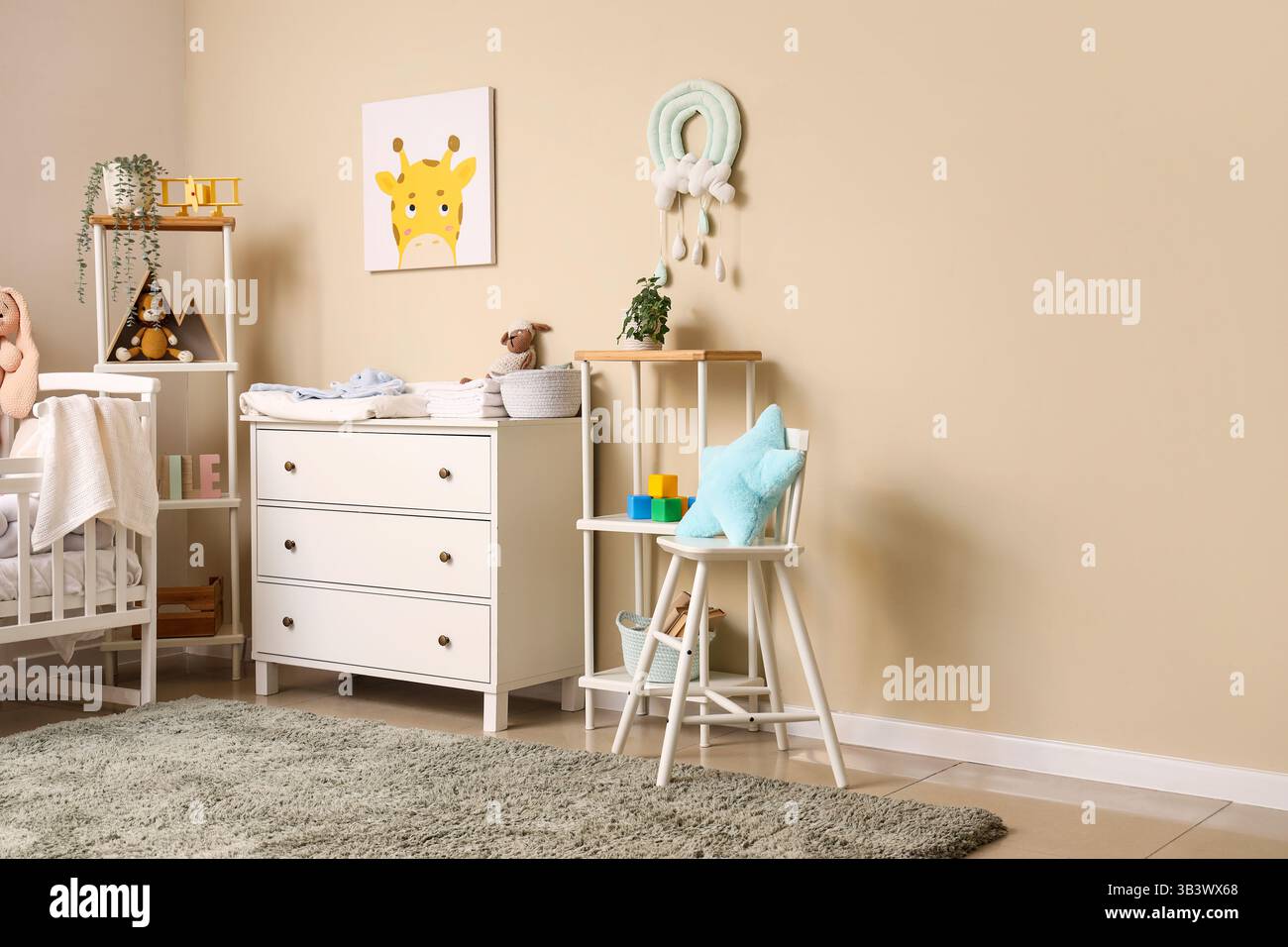 Interior of nursery with commode, chair and shelf units Stock Photo - Alamy