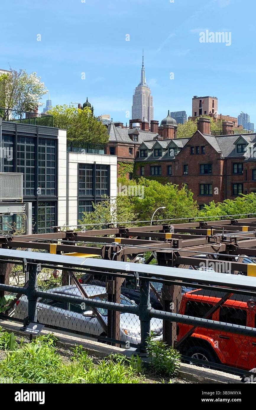 Midday in New York with high population density, moving taxis, and ...