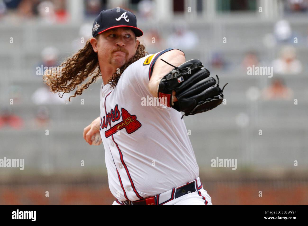 ATLANTA, GA - APRIL 20: Grant Holmes #66 of the Atlanta Braves delivers ...