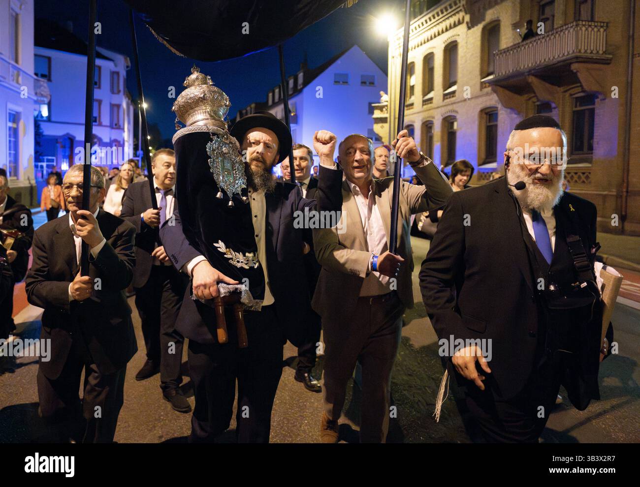 Hanau, Germany. 29th Apr, 2025. In a solemn procession, the new Torah ...