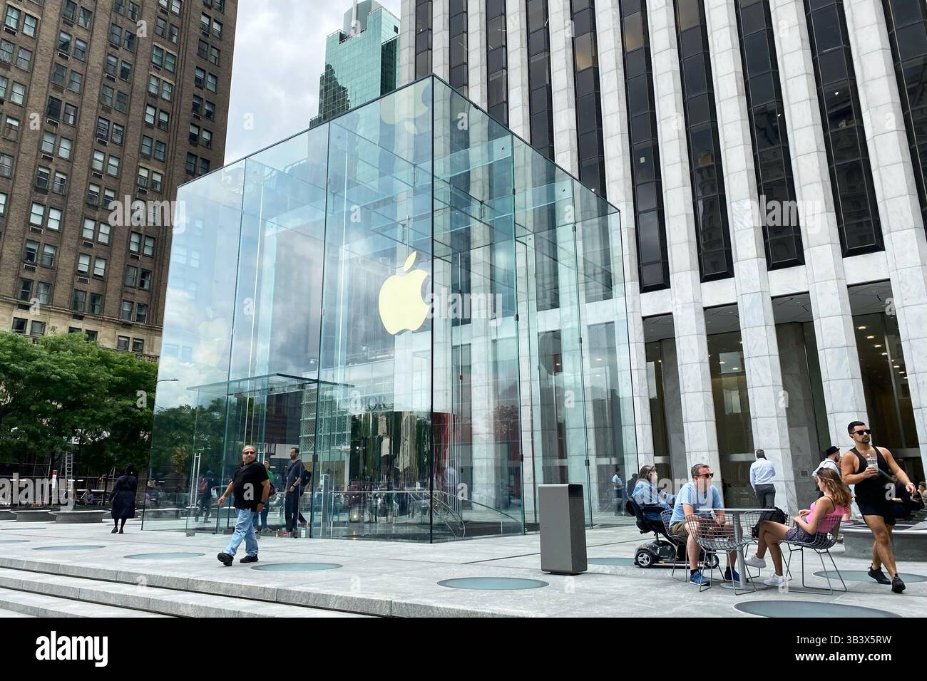 People visit the Apple Store in Manhattan, New York City. Apple is an ...